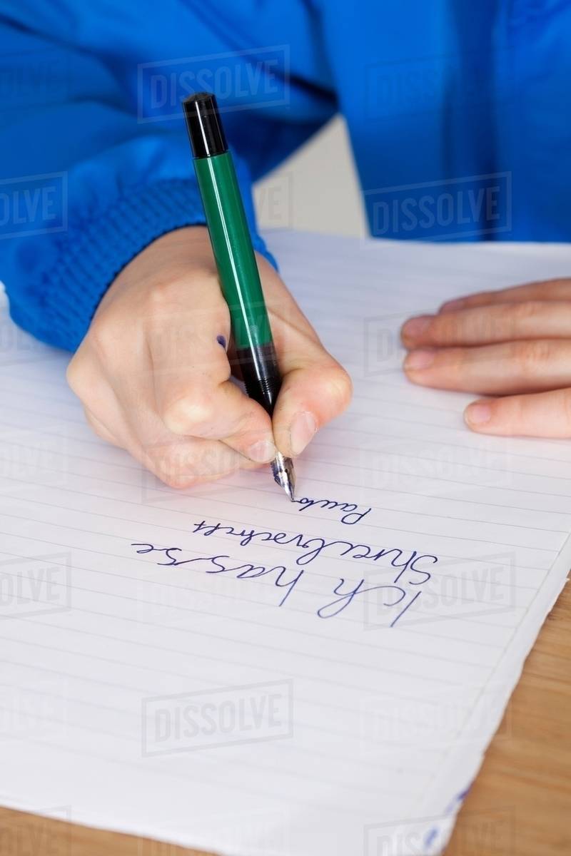 Student practicing handwriting in class - Royalty-free Stock Photo ...