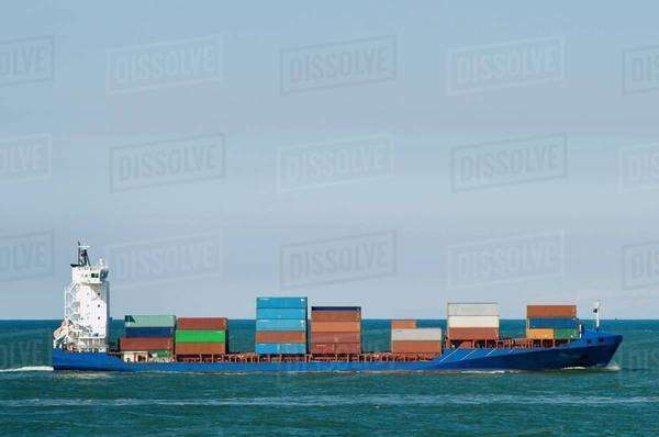 Industrial barge carrying containers - Stock Photo - Dissolve