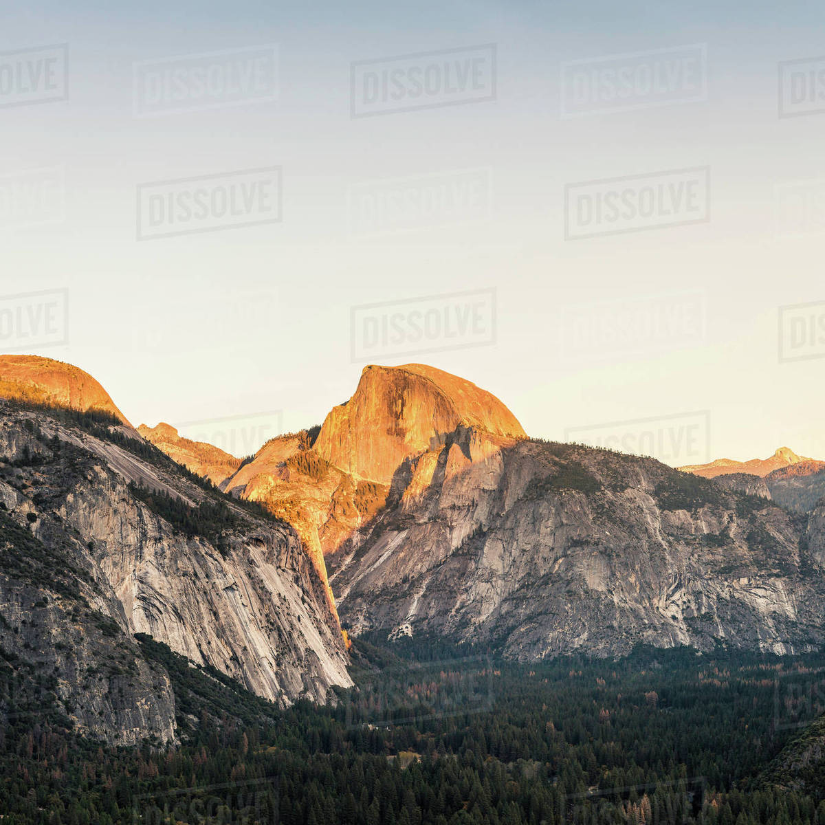Elevated view of valley forest and mountains at sunset, Yosemite ...