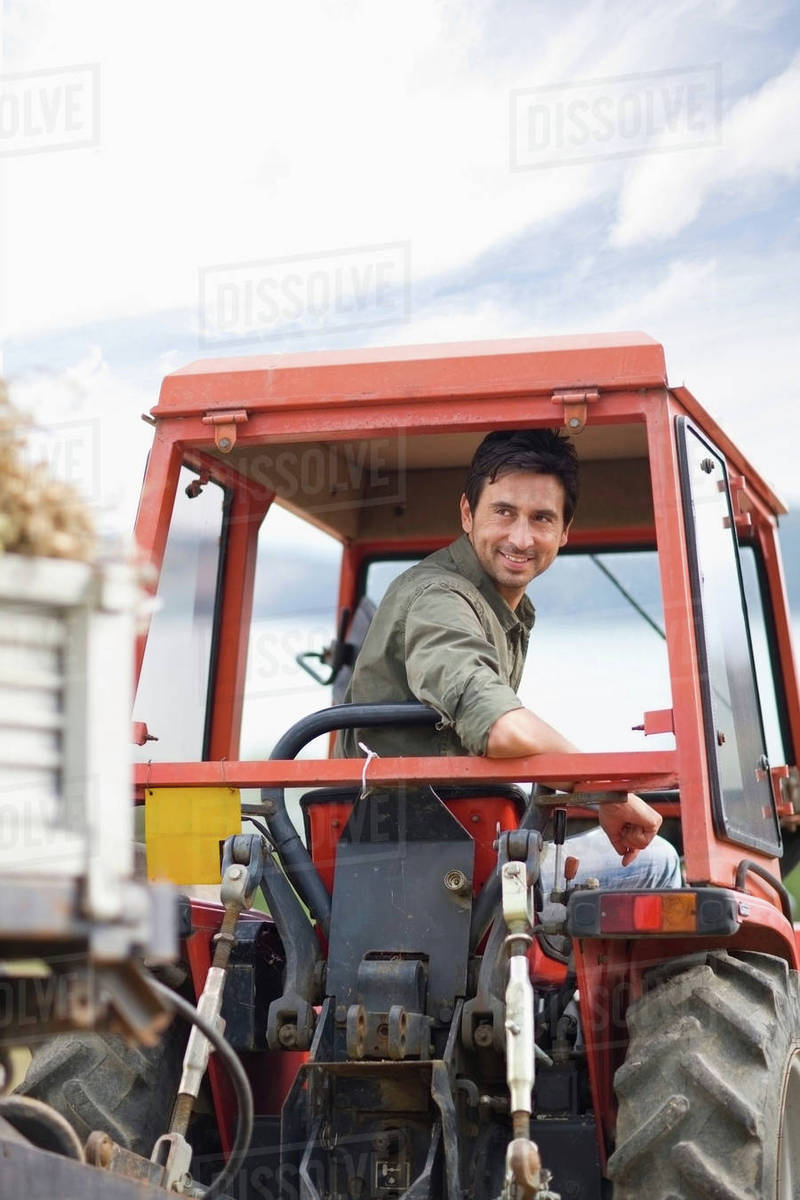Farmer in his tractor - Royalty-free Stock Photo | Dissolve
