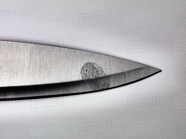 Close up of fingerprint on knife blade - Stock Photo - Dissolve