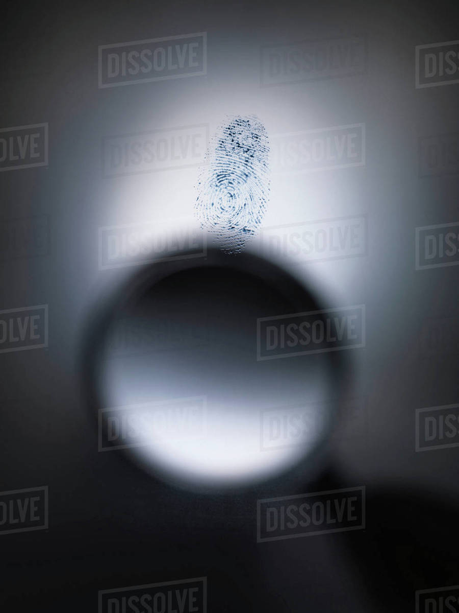 Fingerprint under magnifying glass - Royalty-free Stock Photo | Dissolve