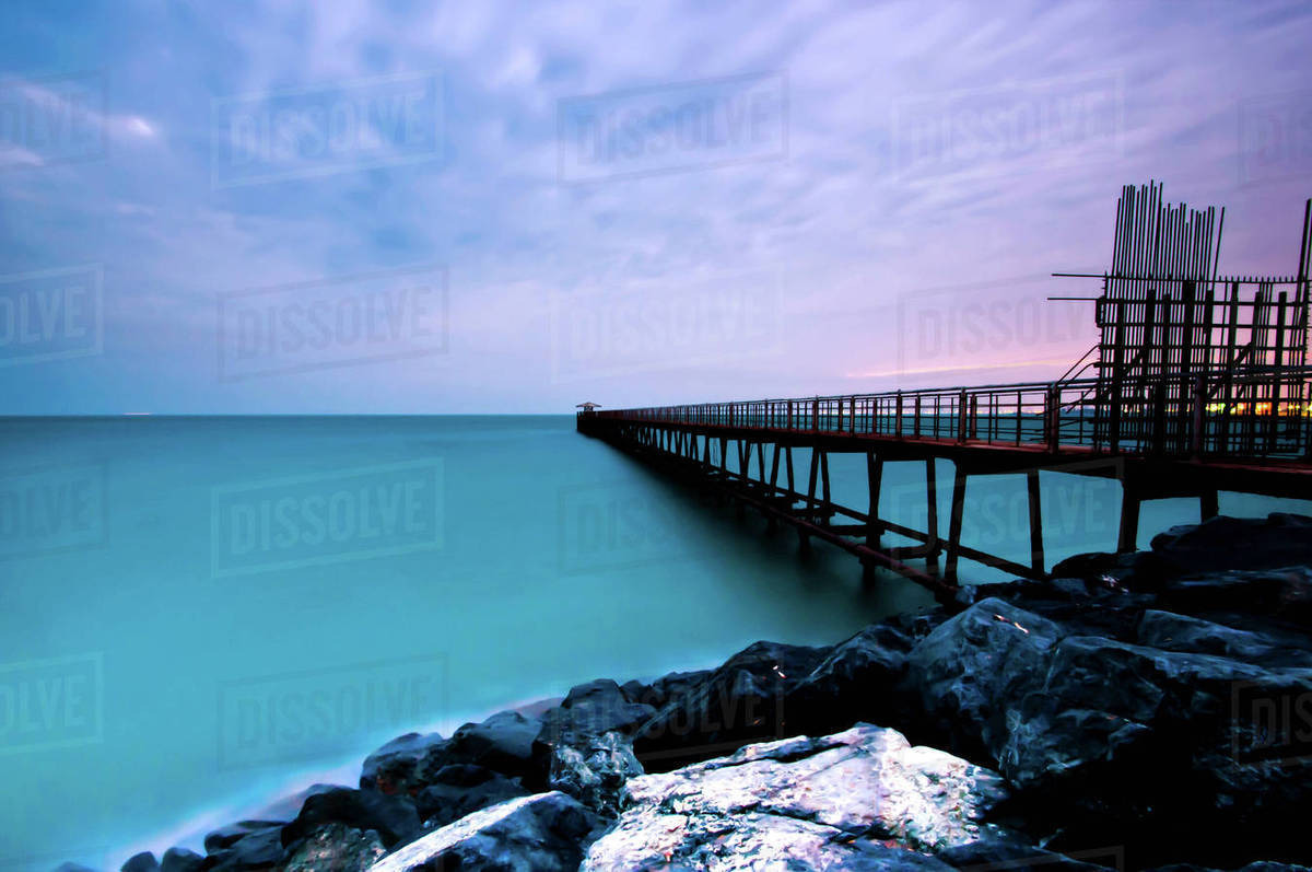 Long exposure of wooden pier over water - Royalty-free Stock Photo ...