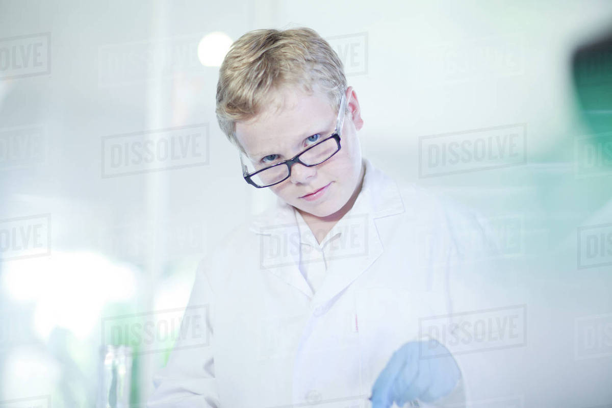 Boy playing scientist in lab - Royalty-free Stock Photo | Dissolve