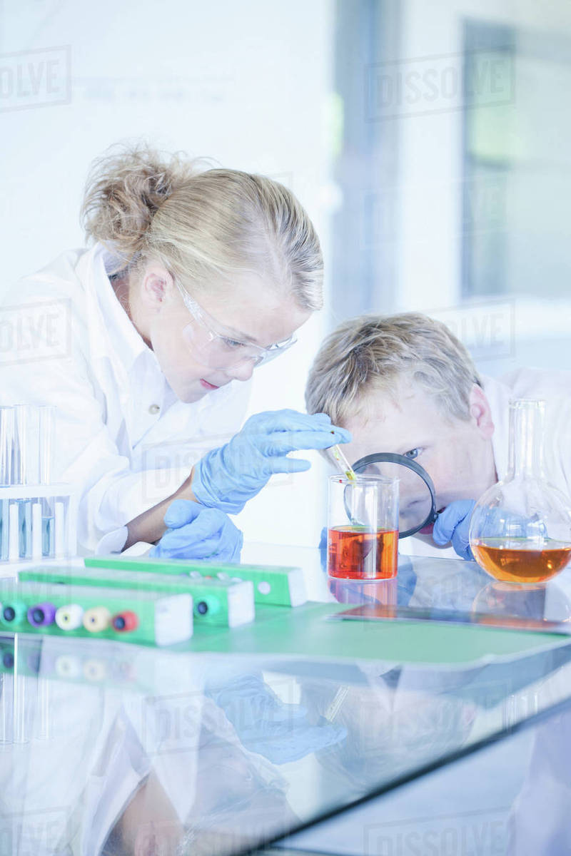 Children playing scientists in lab - Royalty-free Stock Photo | Dissolve