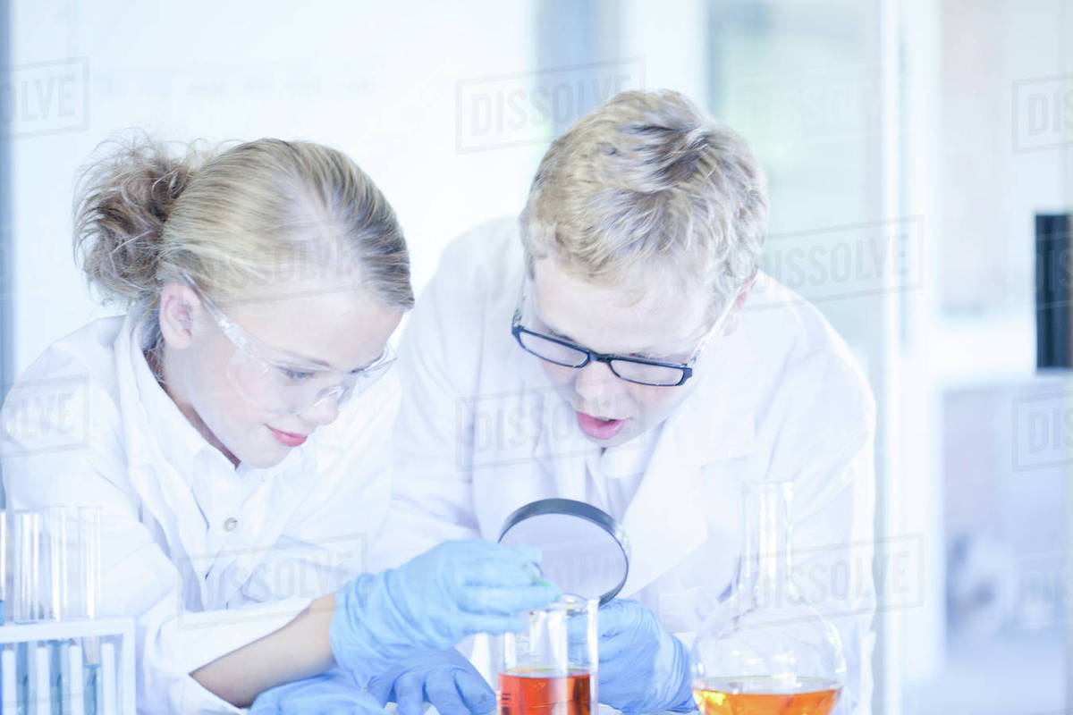 Children playing scientists in lab - Stock Photo - Dissolve