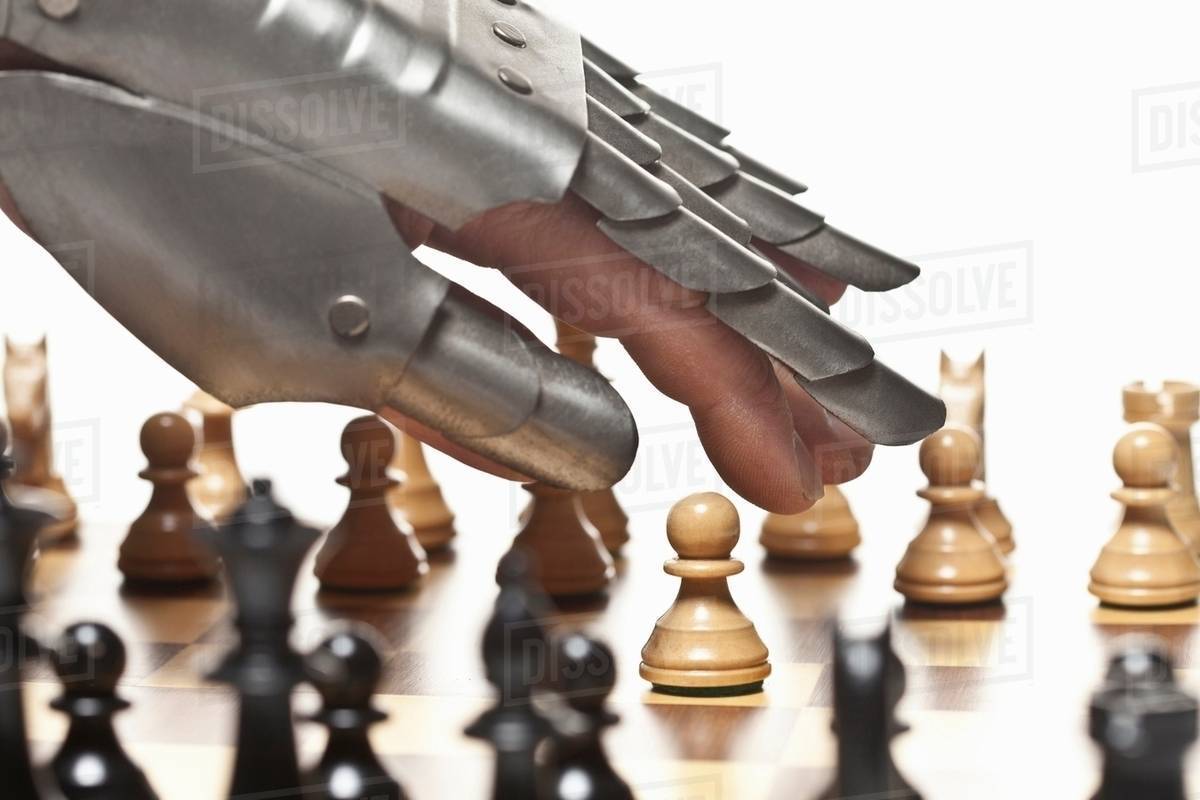 Close up of armored hand playing chess - Royalty-free Stock Photo ...