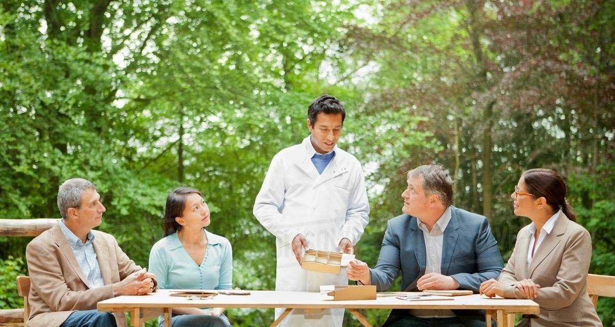 Scientist talking in meeting - Royalty-free Stock Photo | Dissolve