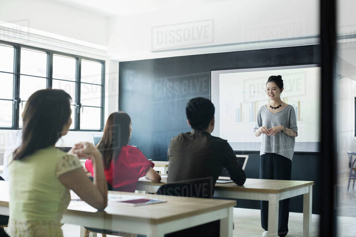 Lecturer delivering lesson in class - Royalty-free Stock Photo | Dissolve