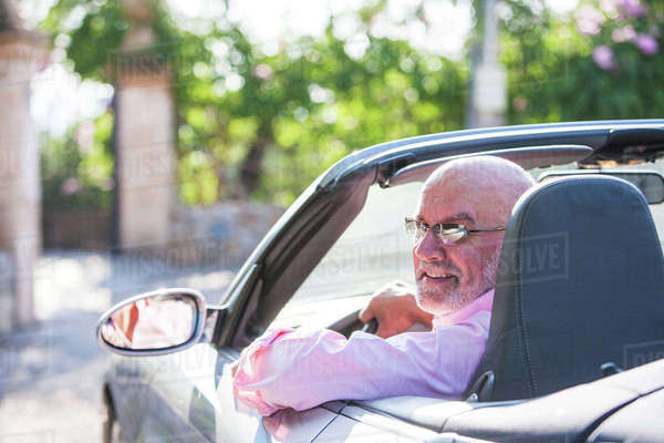 Portrait of senior man in convertible car - Royalty-free Stock Photo ...