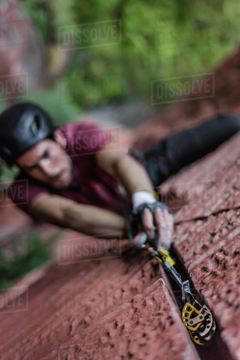 Rock climbers climbing sandstone rock, overhead view, Liming, Yunnan ...