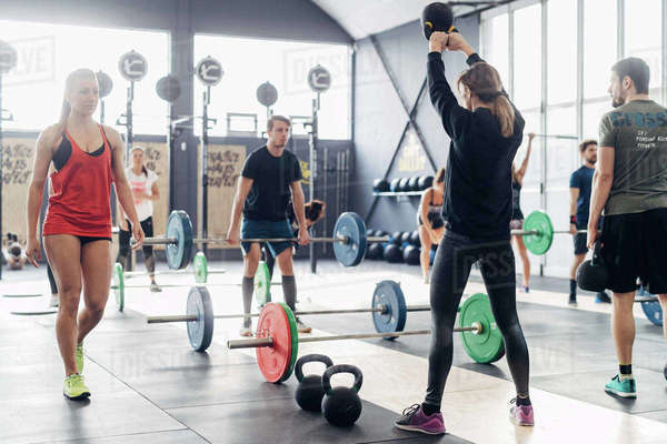 Group of people weightlifting in gym - Royalty-free Stock Photo | Dissolve