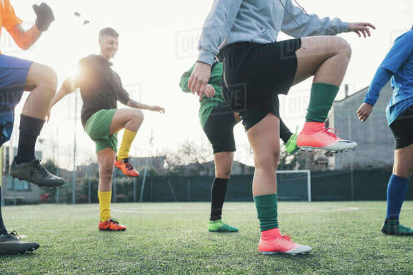 Football players warming up before game - Royalty-free Stock Photo ...