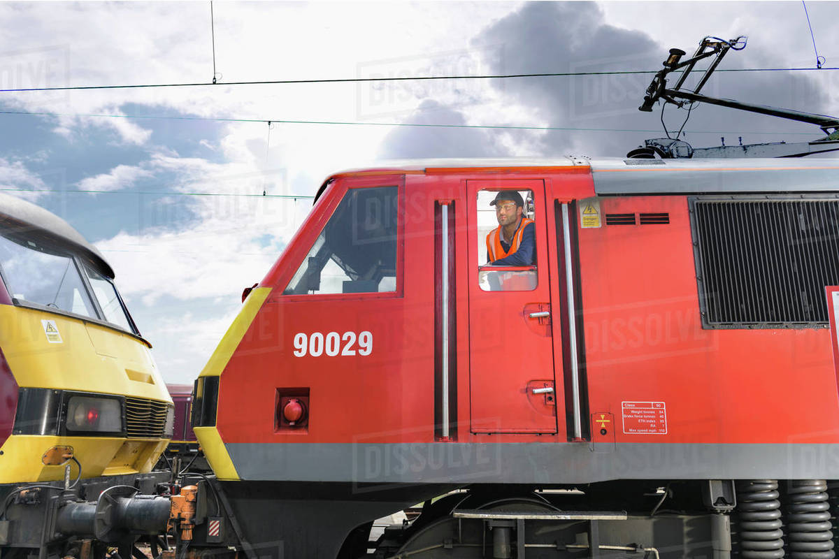 Train driver in locomotive cab in train engineering factory - Stock ...