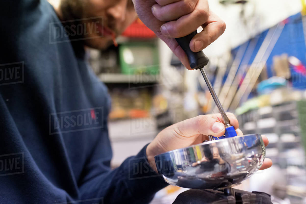 Fencing prop maker at work - Stock Photo - Dissolve