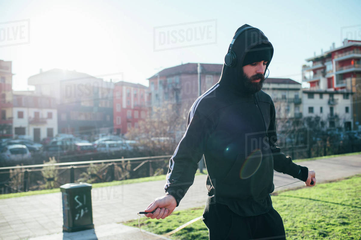 Man skipping in park - Royalty-free Stock Photo | Dissolve