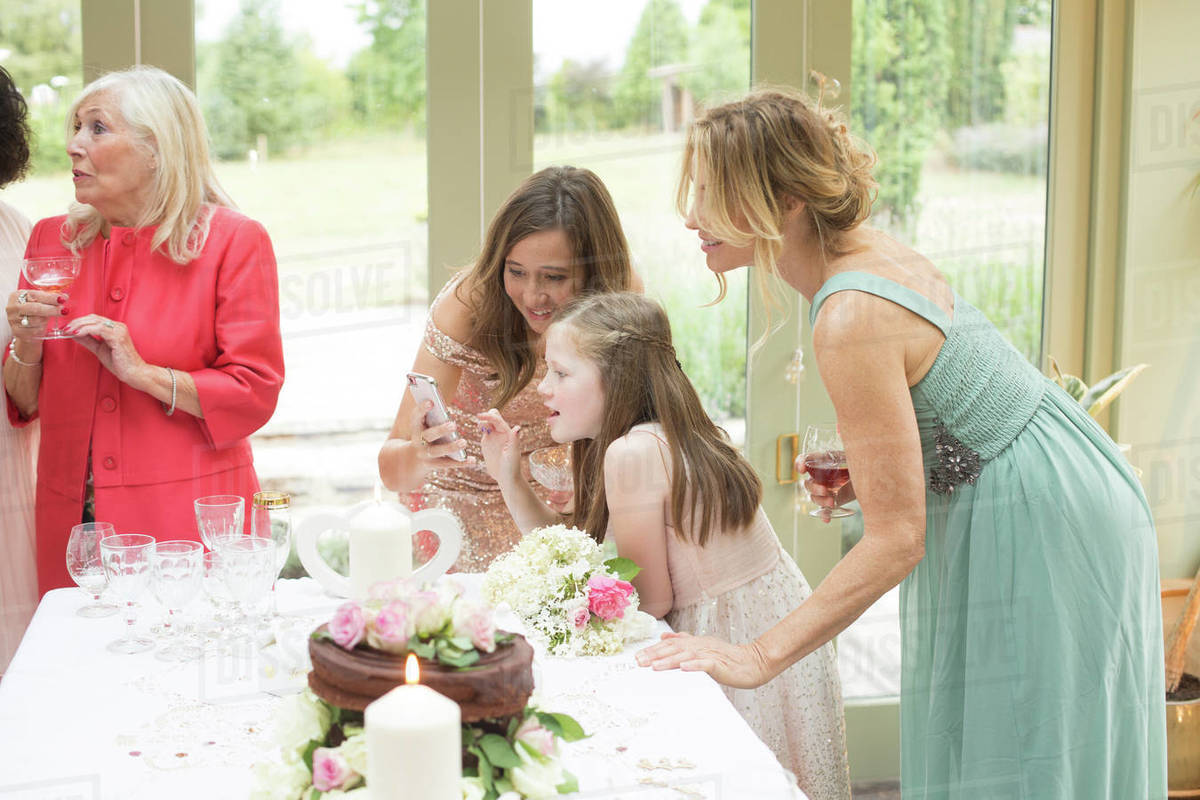 Female wedding guests at reception - Royalty-free Stock Photo | Dissolve