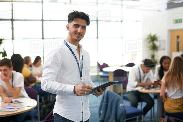 Young male higher education student in college classroom, portrait ...