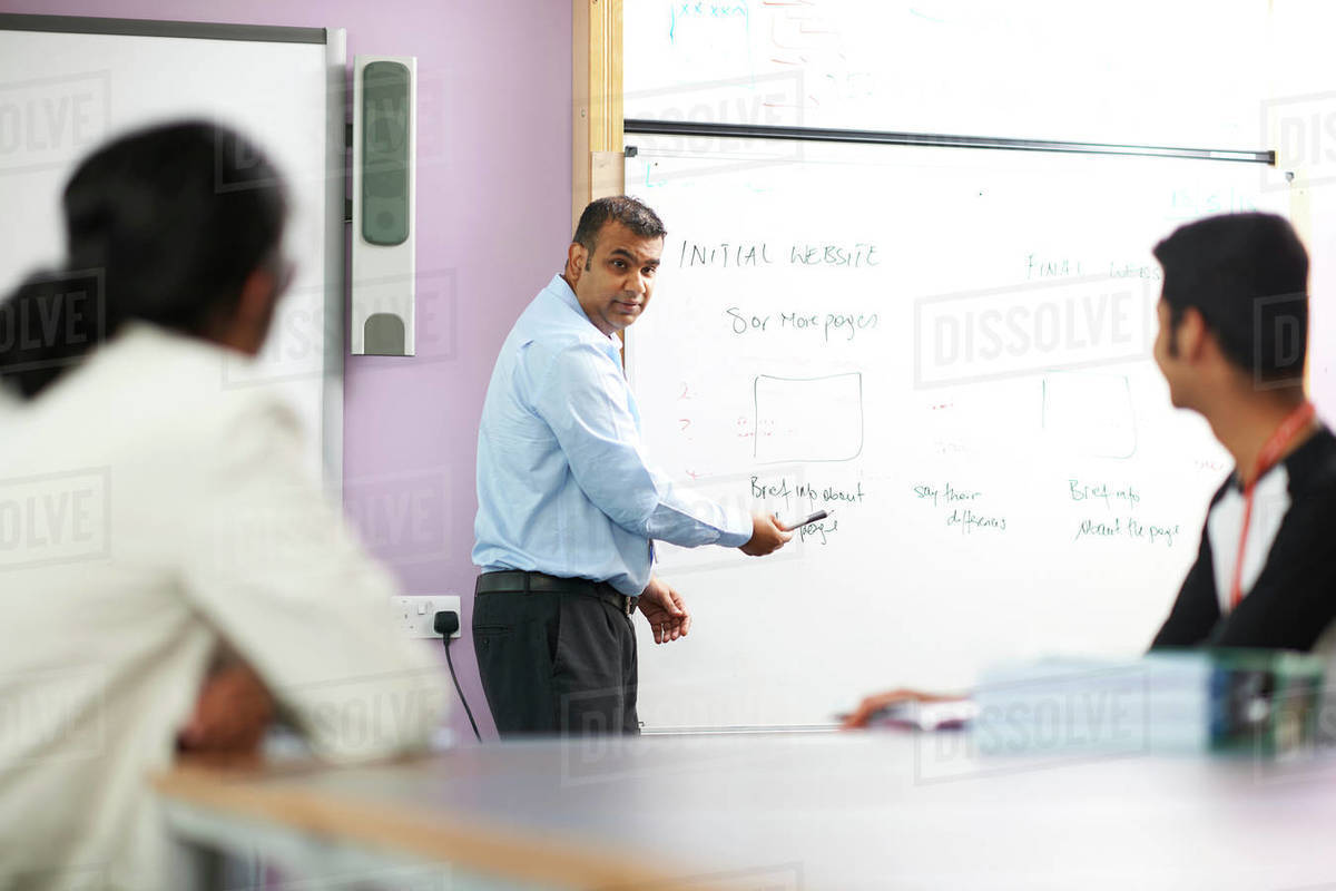 Lecturer talking to college students in classroom - Royalty-free Stock ...