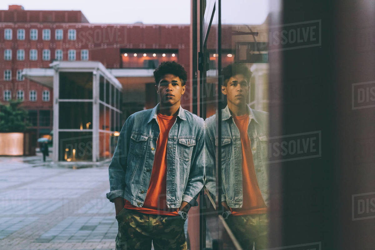 Man leaning against glass window, Milan, Italy - Royalty-free Stock ...