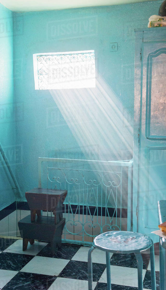 Sunrays coming in through window - Stock Photo - Dissolve