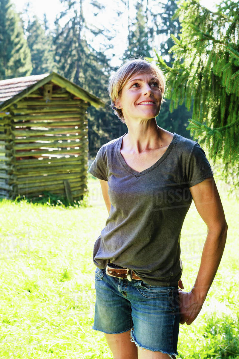 Woman enjoying countryside - Royalty-free Stock Photo | Dissolve