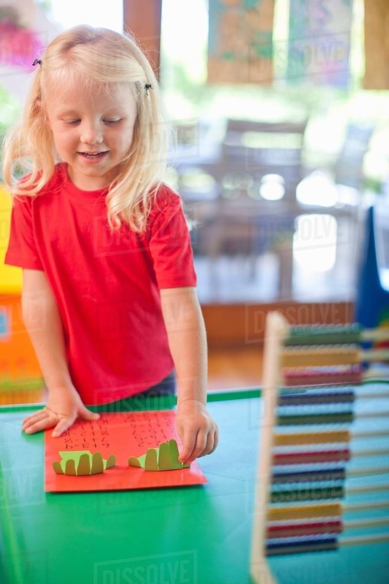 Girl counting with fingers at nursery school - Royalty-free Stock Photo ...