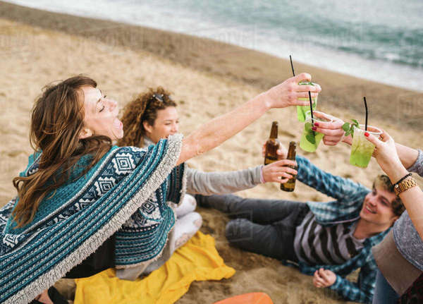 Friends raising at toast at beach party, Barcelona, Spain - Royalty ...
