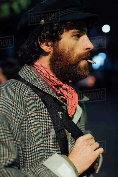 Bearded young man loitering on street - Royalty-free Stock Photo | Dissolve