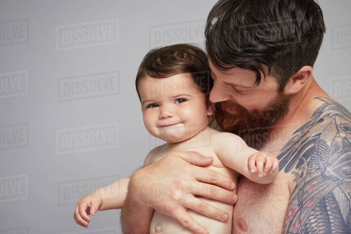 Father hugging baby - Royalty-free Stock Photo | Dissolve