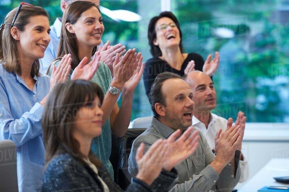 Businesspeople applauding - Stock Photo - Dissolve