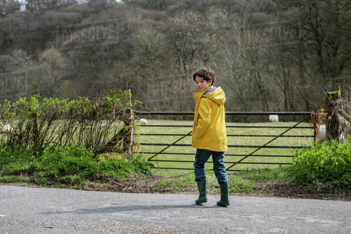 Boy playing in countryside - Royalty-free Stock Photo | Dissolve