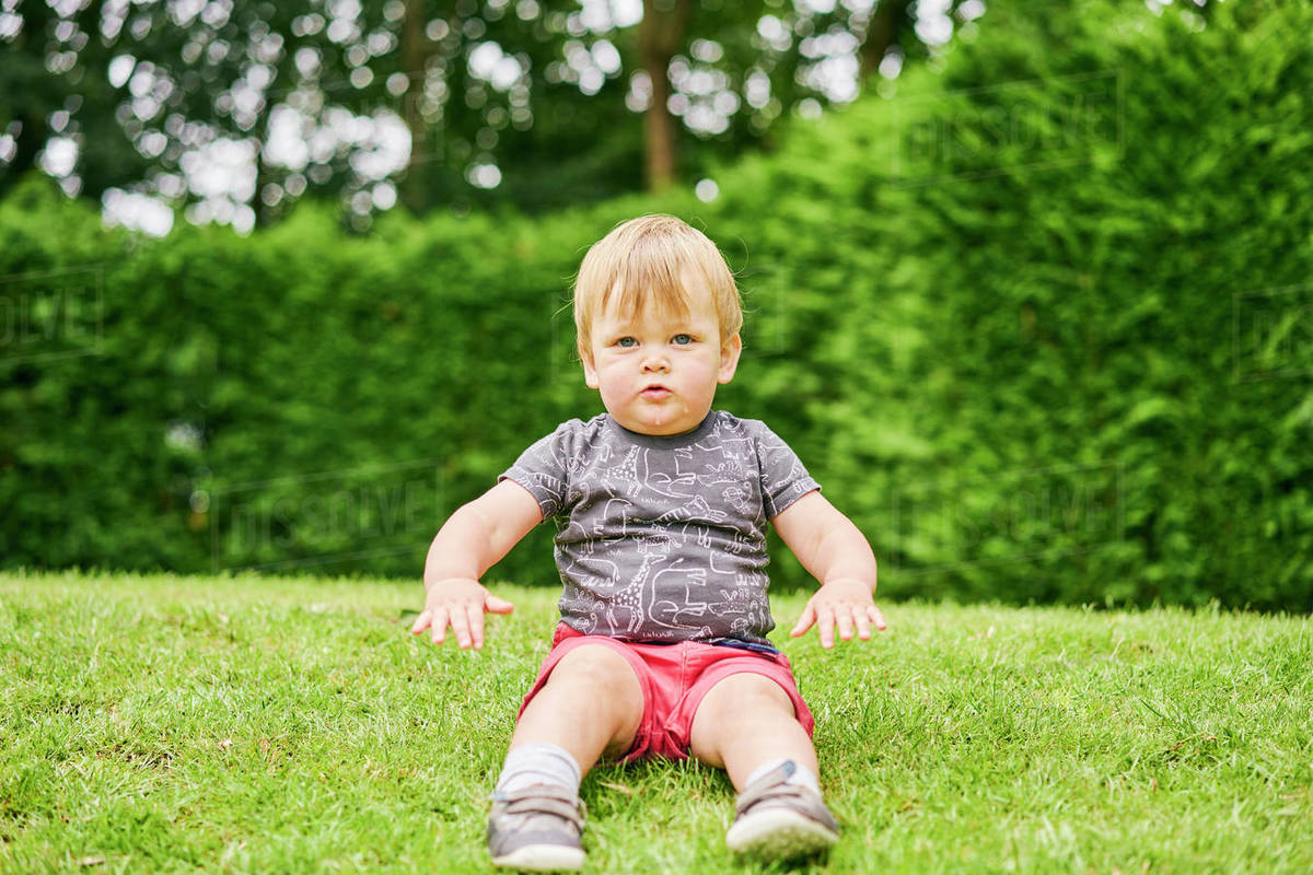 Toddler exploring park - Royalty-free Stock Photo | Dissolve