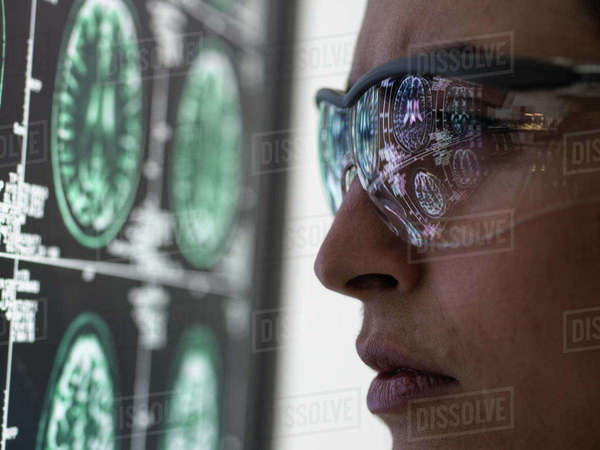 Neurology Diagnosis, Human brain scan on a screen being analysed by a ...