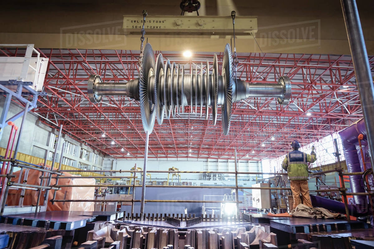 Engineer lowering a turbine in a nuclear power station. - Stock Photo ...