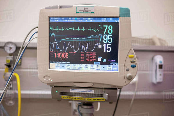 Heart monitor displaying vital signs in a hospital setting. - Stock ...