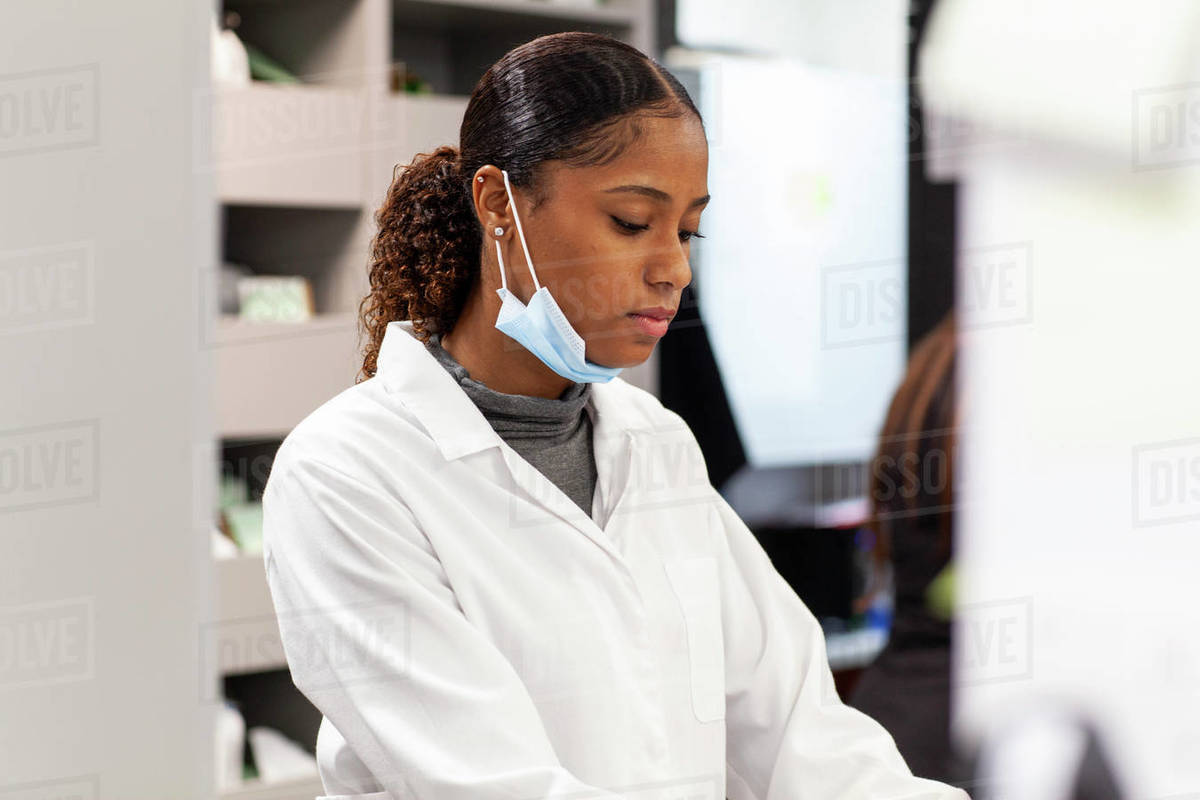 Medical professional in a lab setting, working in a medical practice ...
