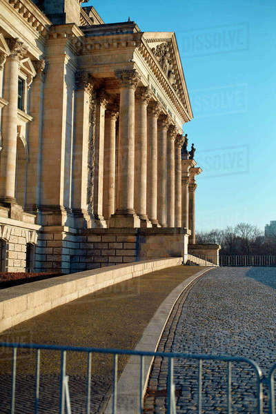 Sunlight bathes the facade of the German Reichstag Building with ...