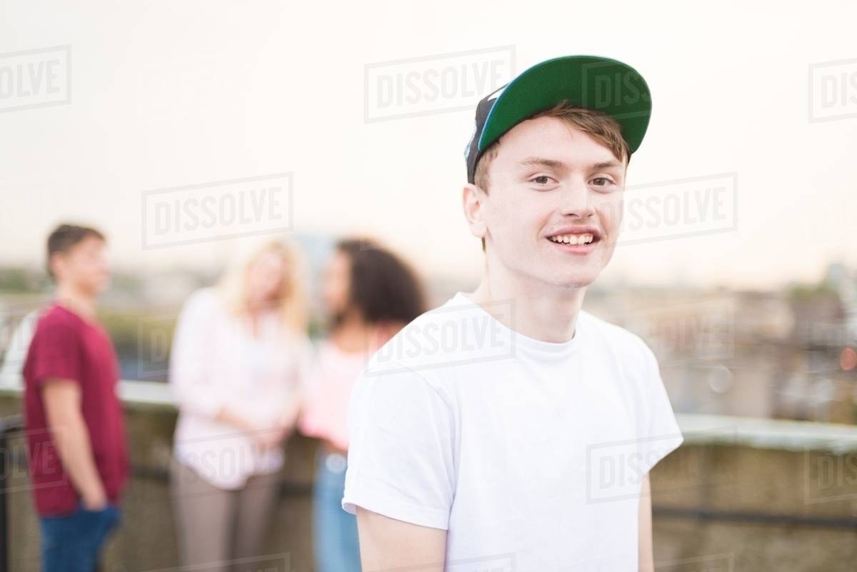 Teenage boy wearing baseball cap - Stock Photo - Dissolve