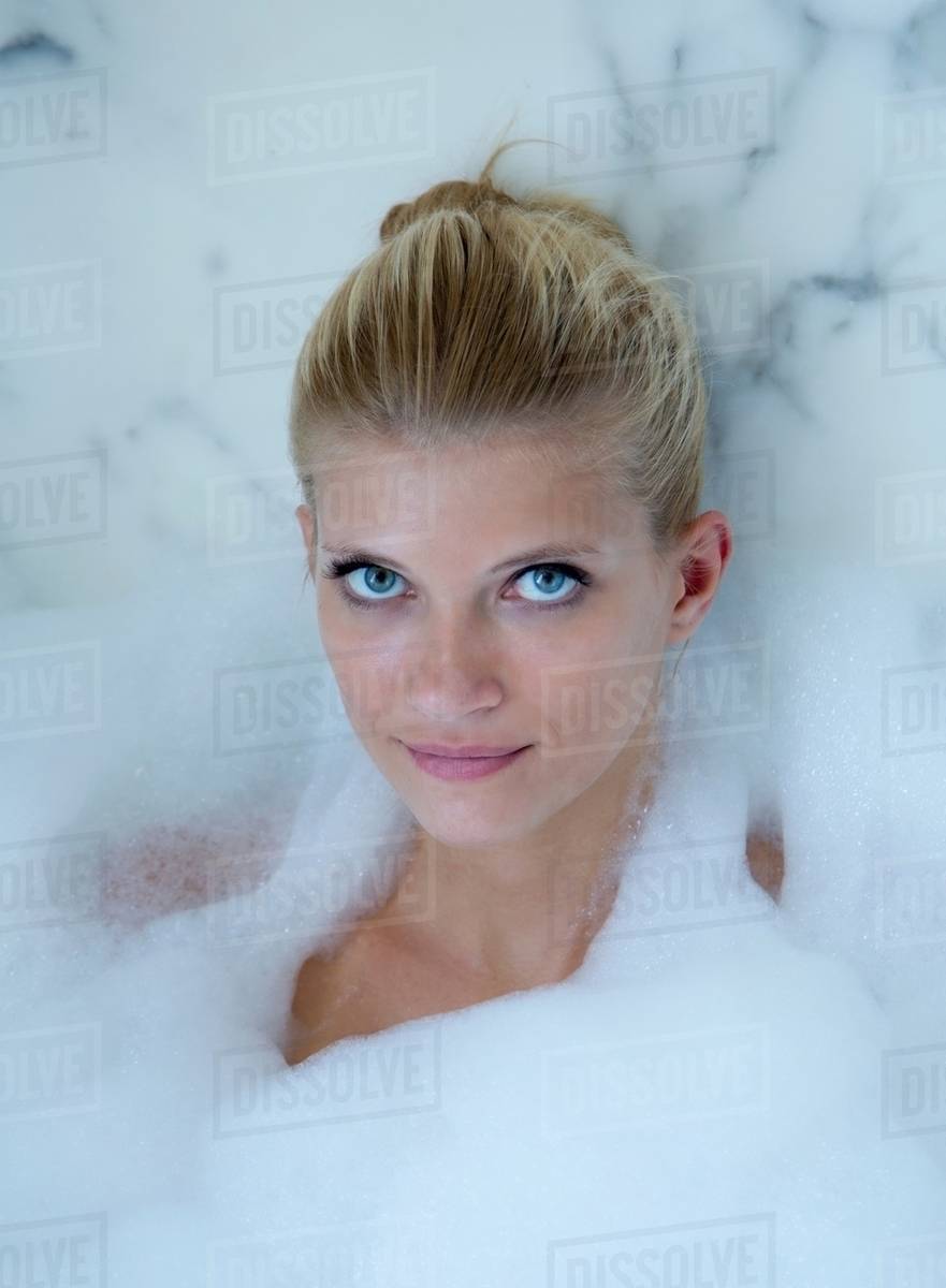 Woman relaxing in bubble bath - Royalty-free Stock Photo | Dissolve