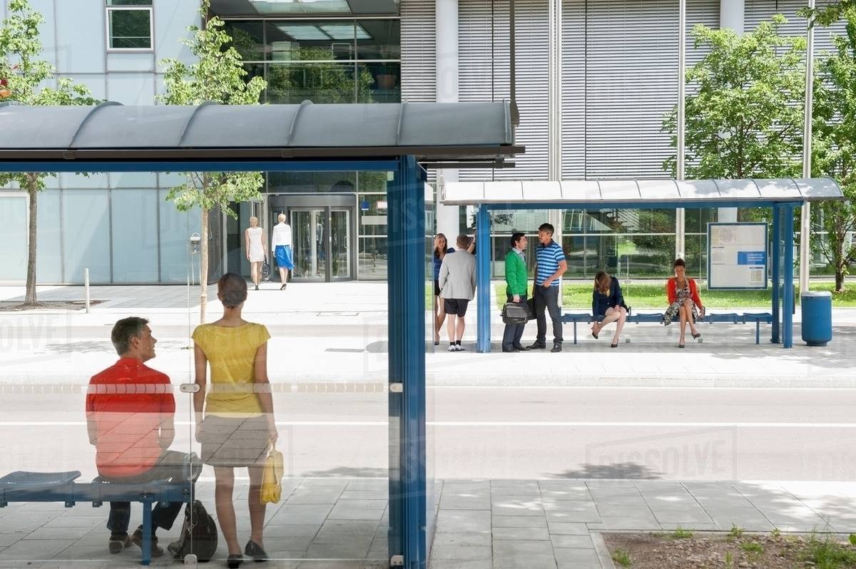 People waiting at bus stops - Stock Photo - Dissolve