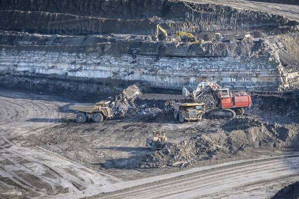 Diggers and coal seams at surface coal mine, high angle - Stock Photo ...