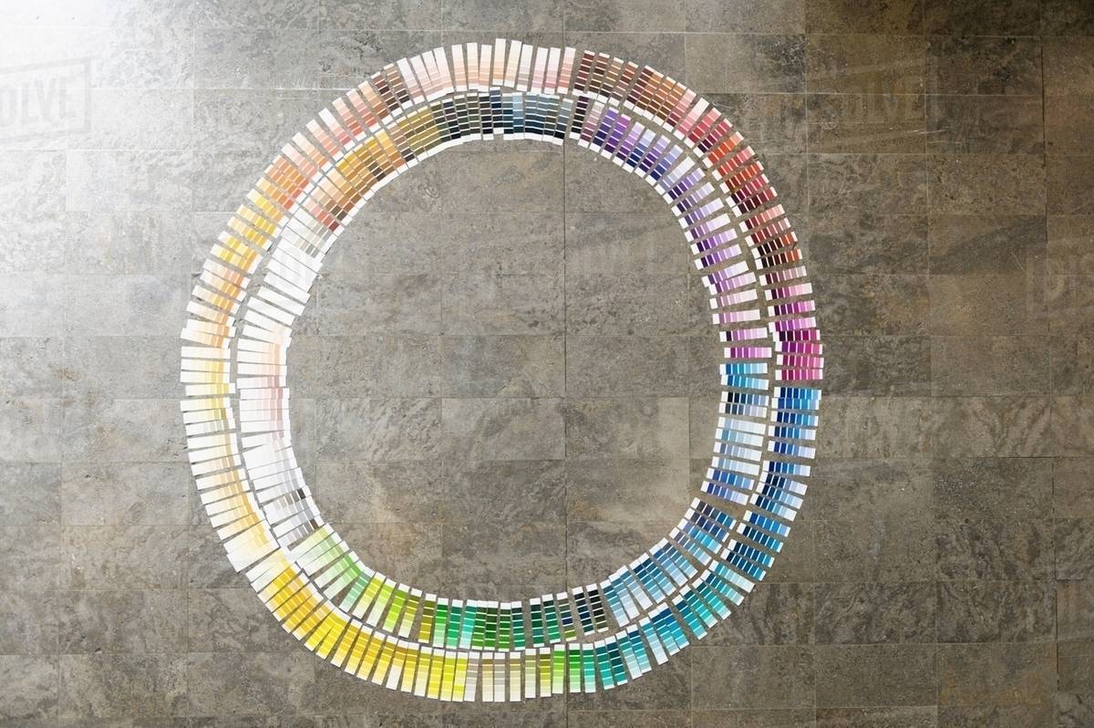 Circle of paint swatches on floor - Stock Photo - Dissolve