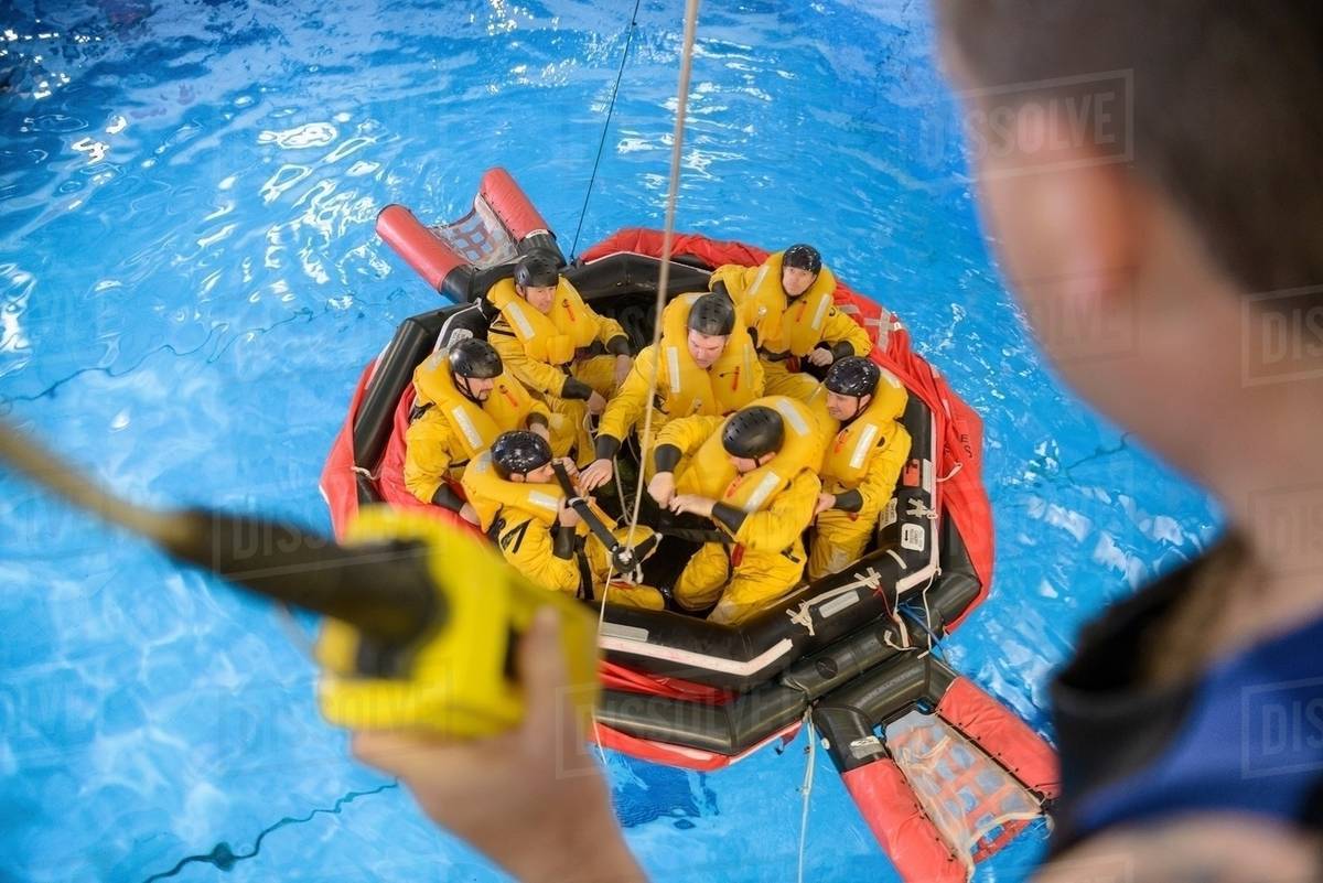 Offshore oil workers hoisted from raft in sea ditching survival ...