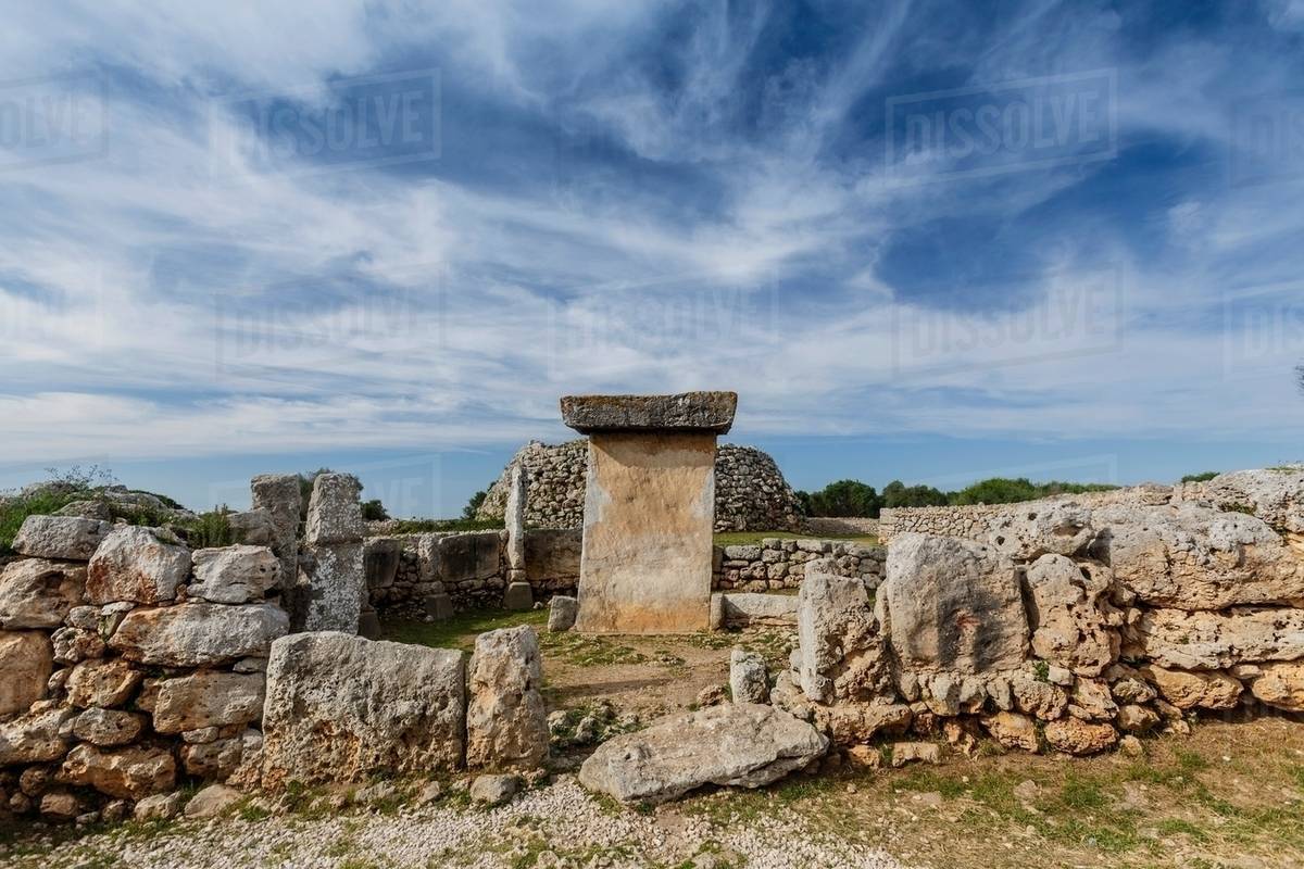 View of taula amongst ancient Talayotic ruins, Menorca, Spain - Royalty ...
