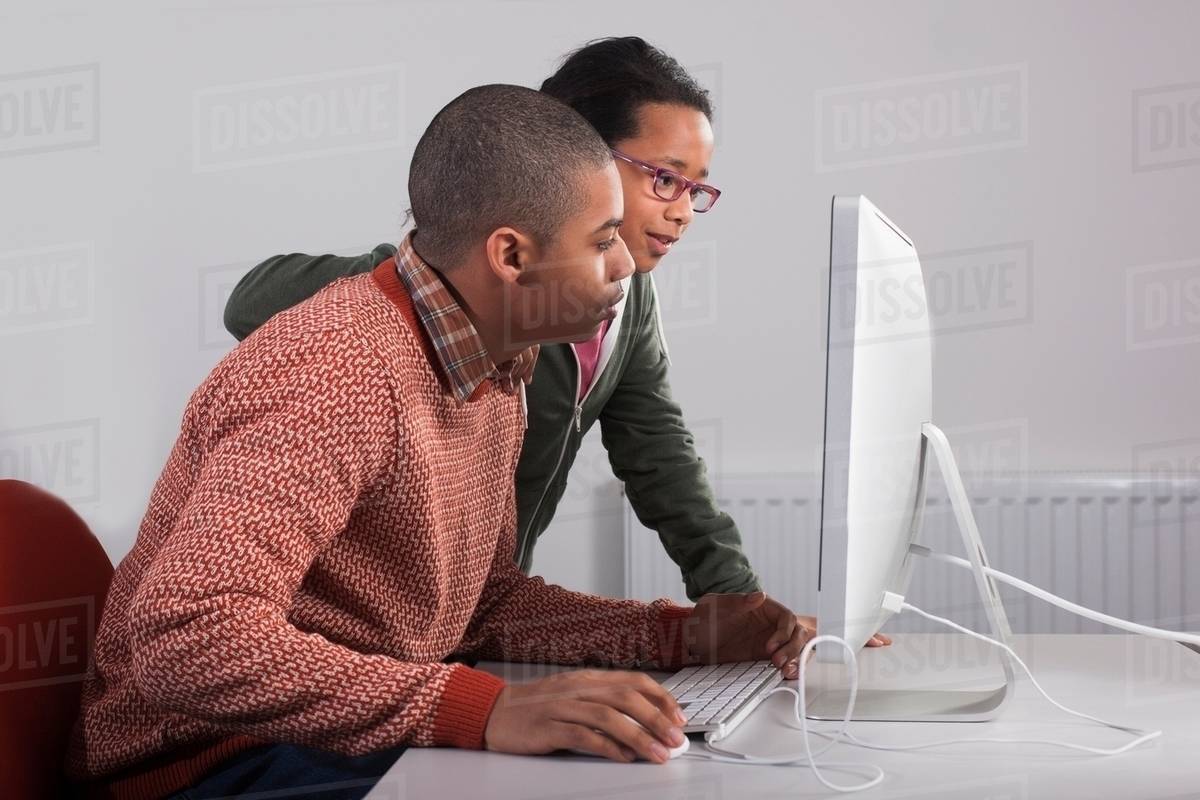 Children using computer together - Royalty-free Stock Photo | Dissolve
