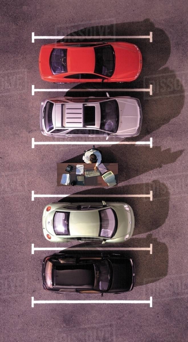 Overhead view of desk in parking lot - Royalty-free Stock Photo | Dissolve