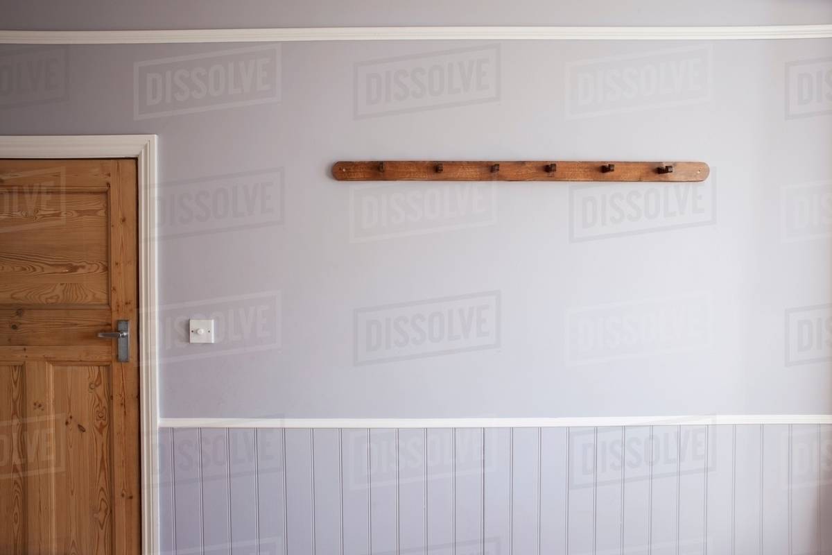 Empty coat rack on wall - Royalty-free Stock Photo | Dissolve