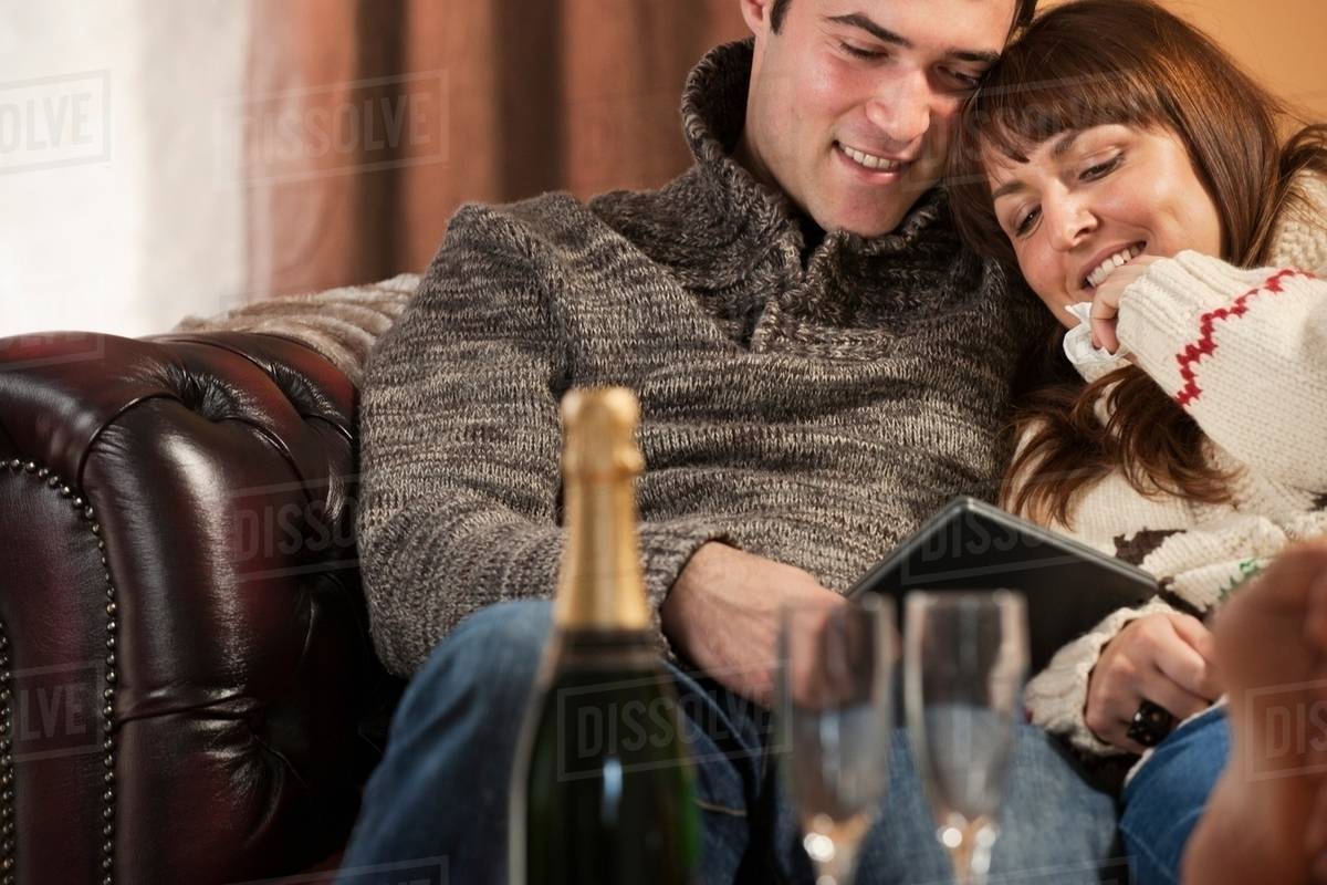 Woman with boyfriend crying at movie - Royalty-free Stock Photo | Dissolve