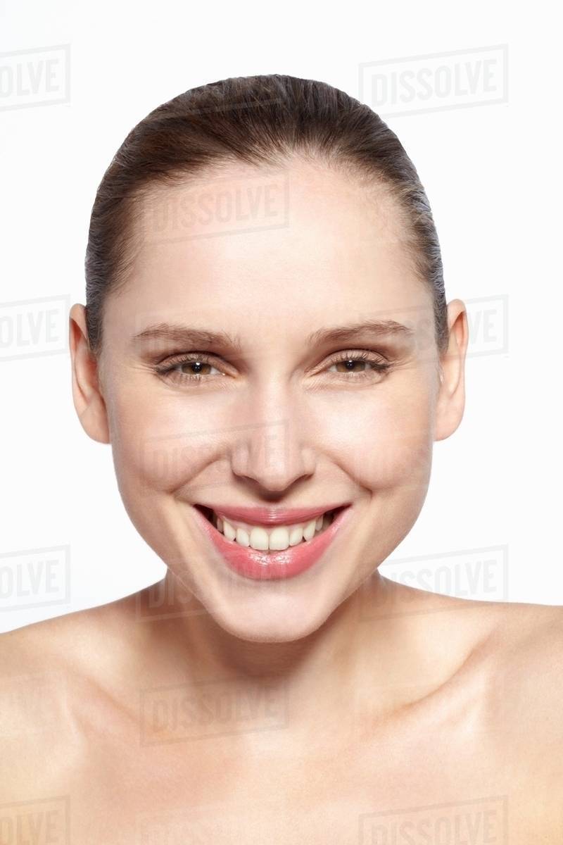 Close up of womans smiling face - Royalty-free Stock Photo | Dissolve